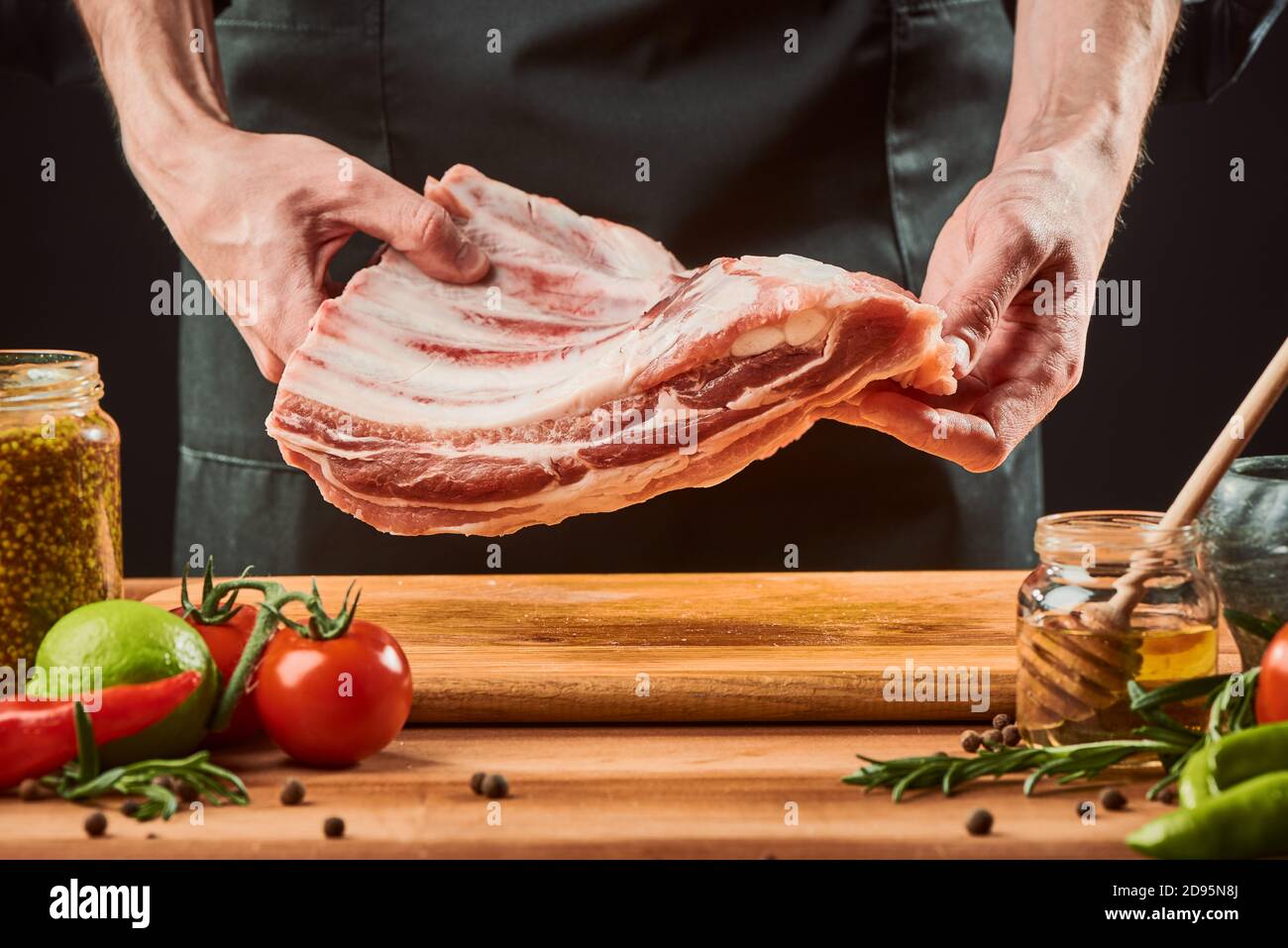 Hand holding piece raw meat hi-res stock photography and images - Alamy