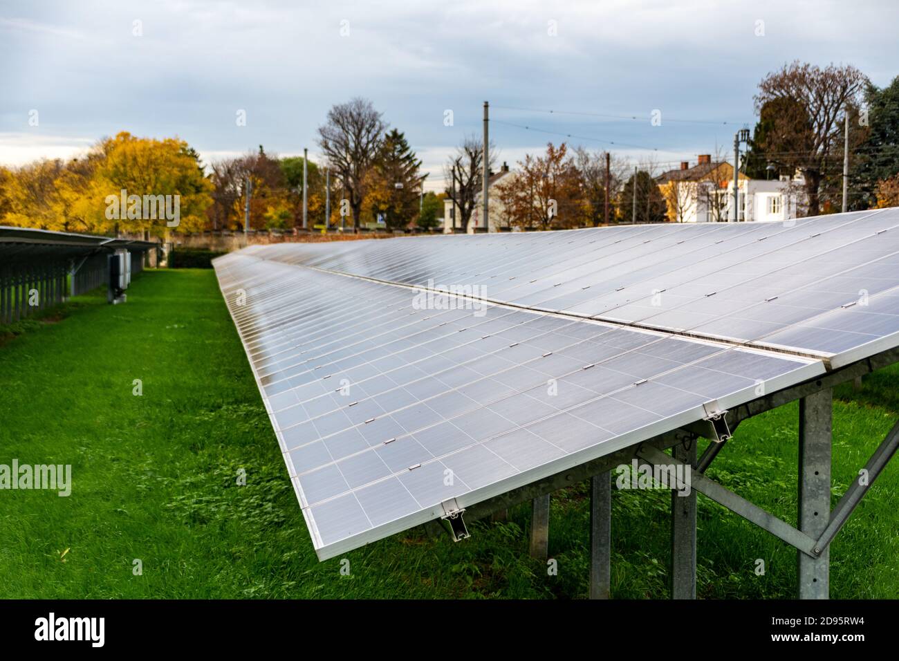 Solar panels (solar cell) in a solar farm with sun lighting to create ...