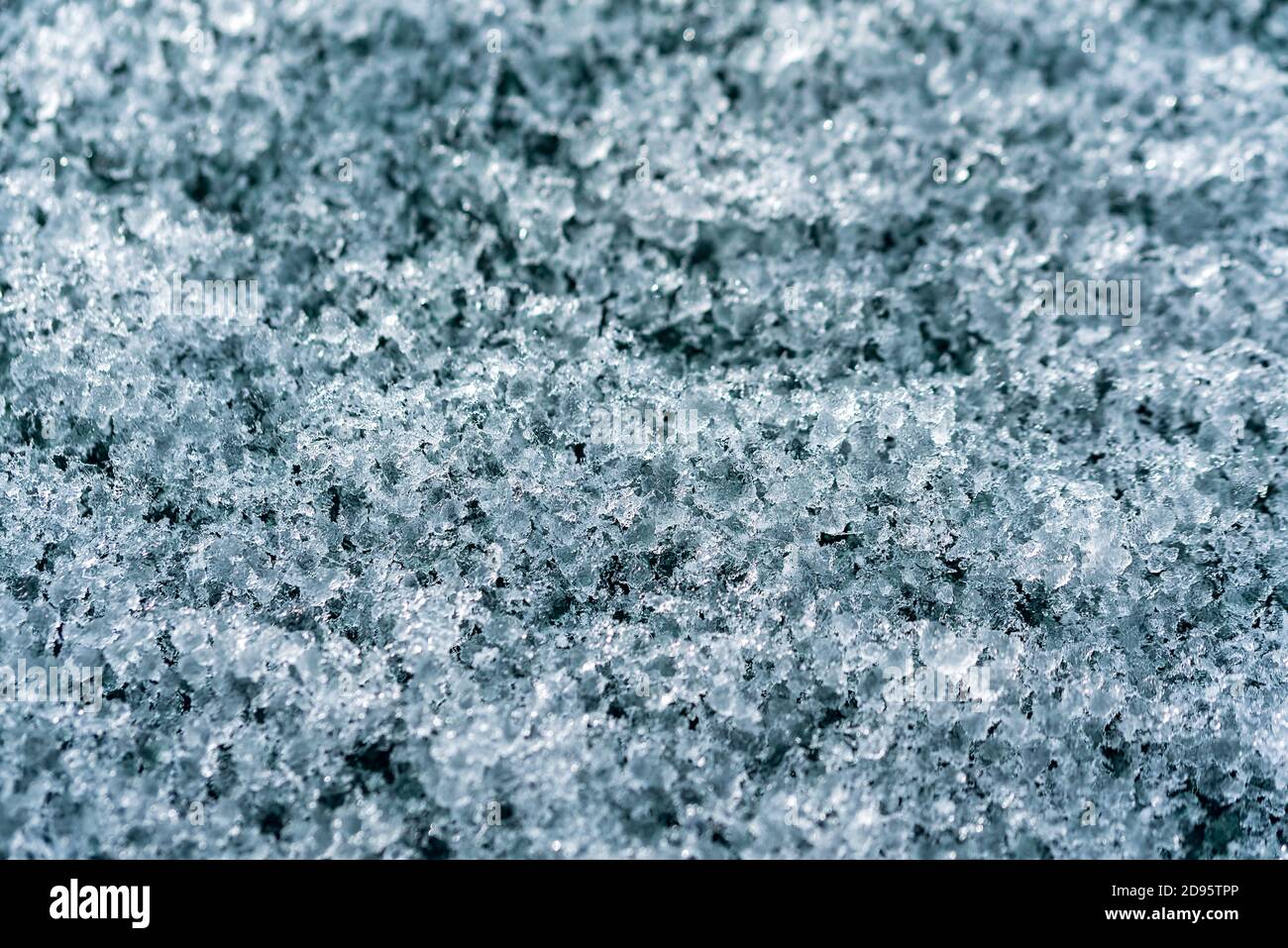 Melting snow on the car window. Close-up of ice crystals turning into ...