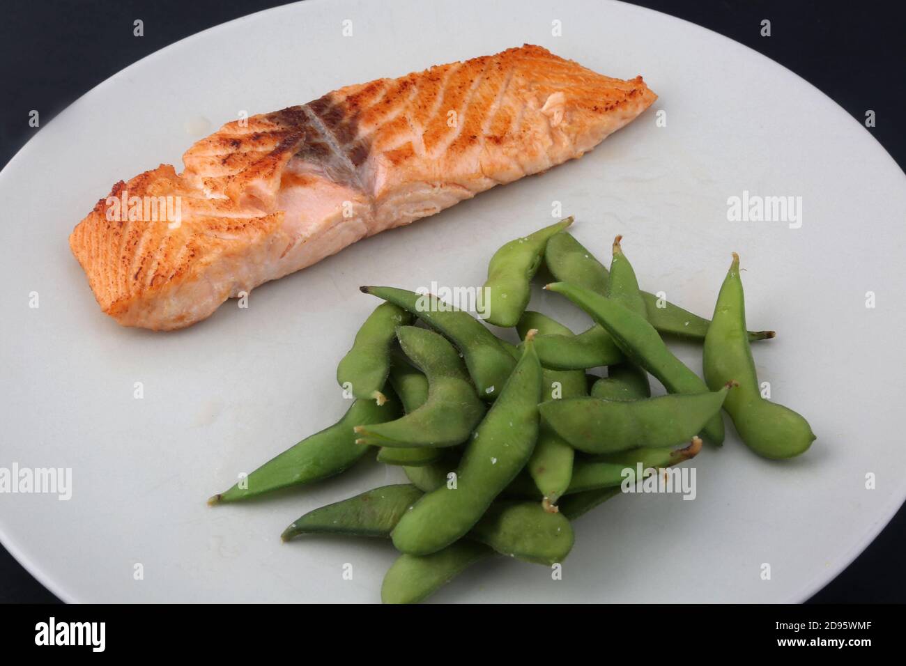 fresh salmon fish with edamame side Stock Photo - Alamy