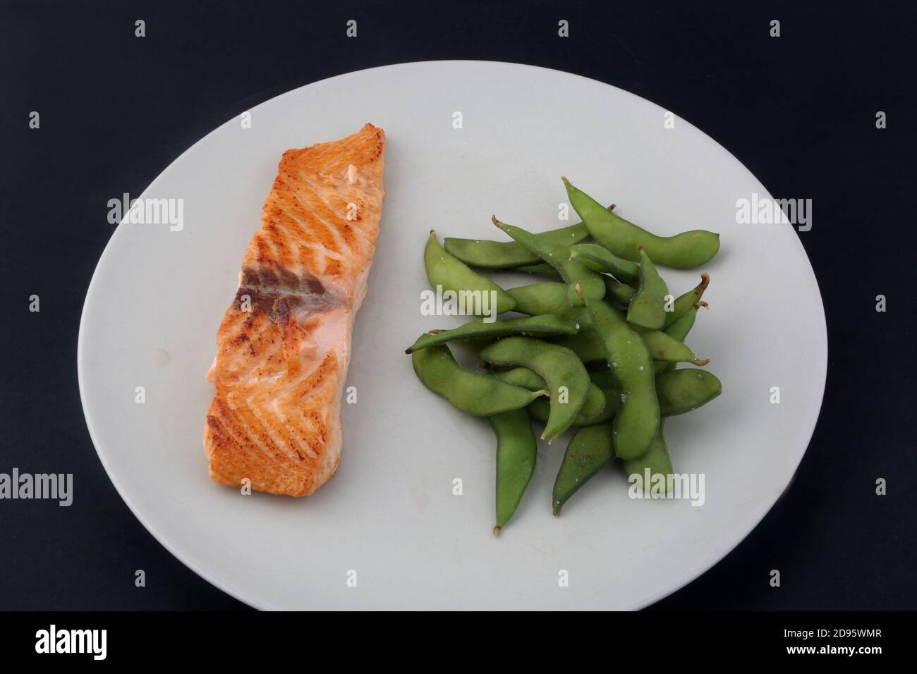 fresh salmon fish with edamame side Stock Photo - Alamy