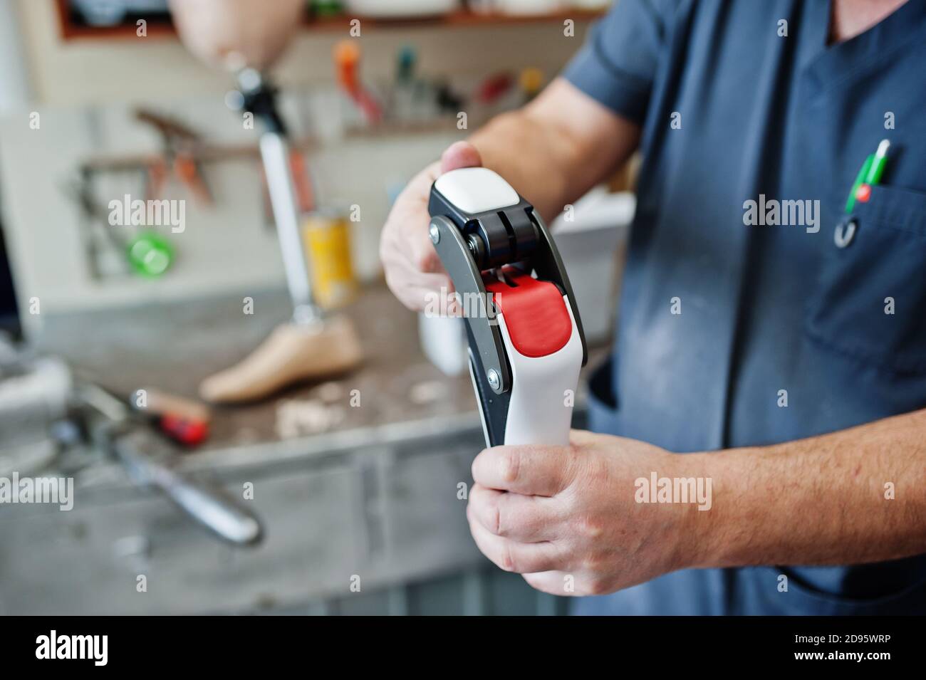 Prosthetist man making prosthetic leg while working in laboratory Stock ...