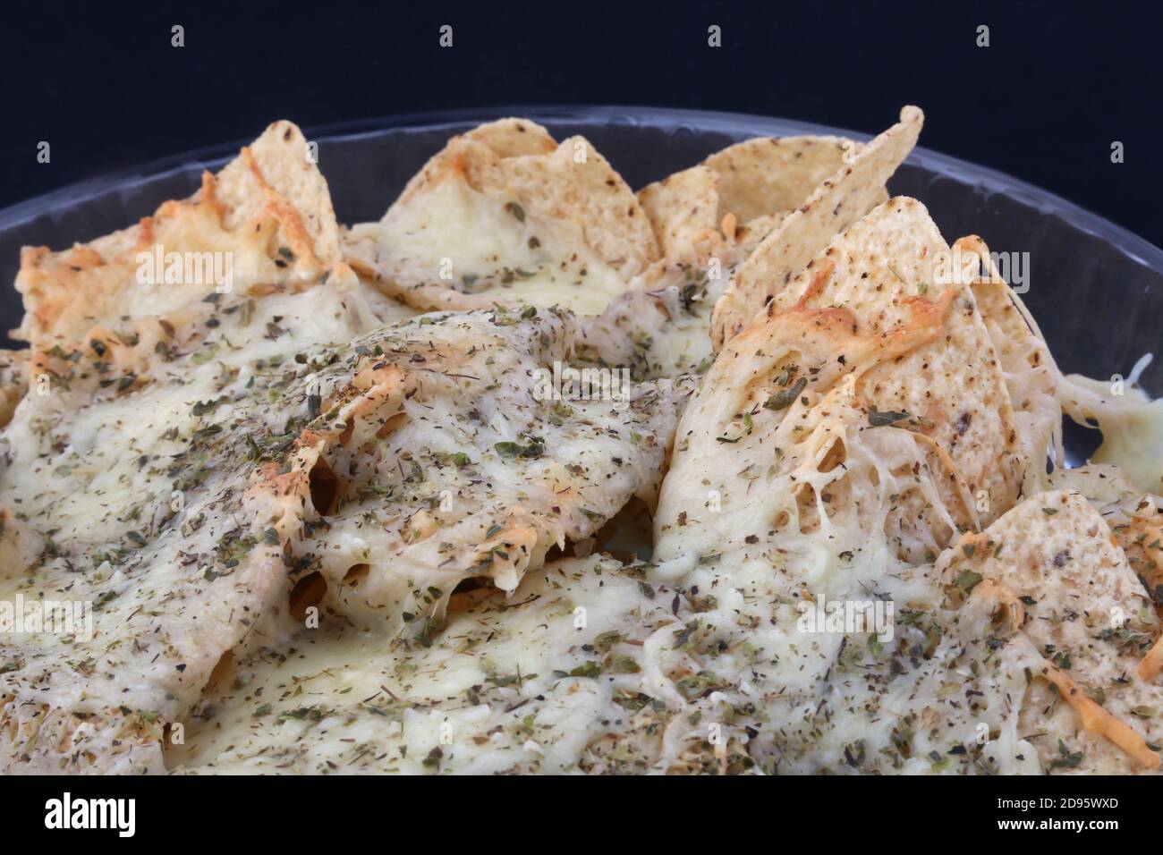 mexican snack nachos with cheese and herbs Stock Photo - Alamy