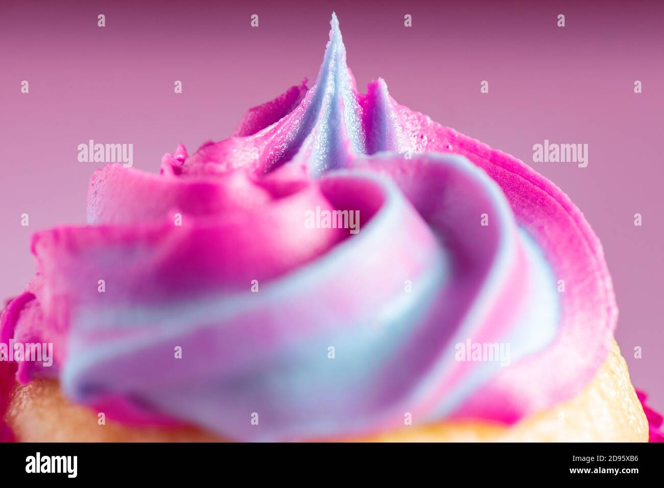 Rainbow icing and vanilla cupcake, sweet food background Stock Photo ...