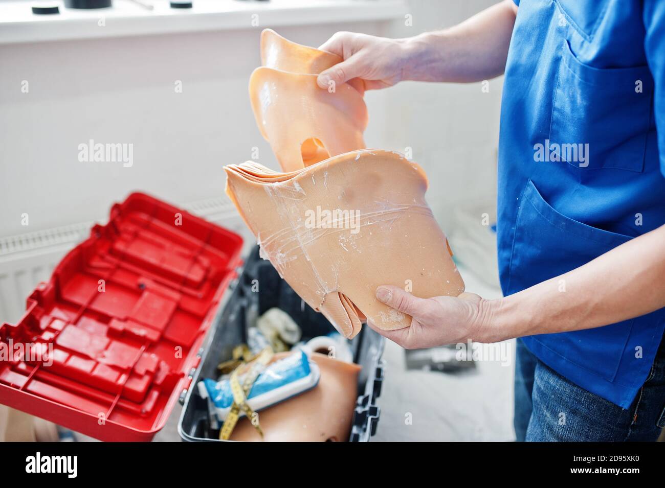 Prosthetist man making prosthetic leg while working in laboratory Stock ...