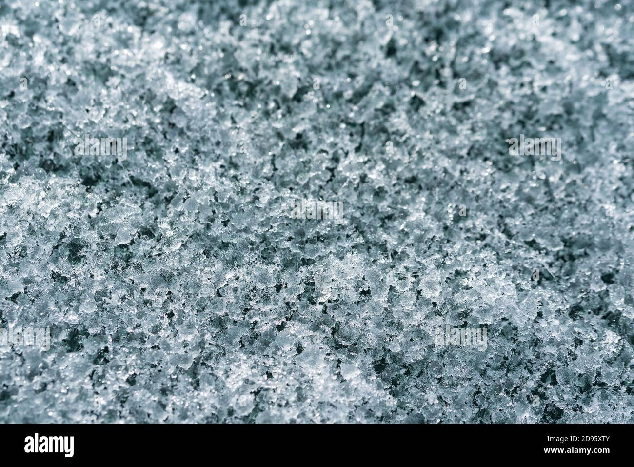 Melting snow on the car window. Close-up of ice crystals turning into ...