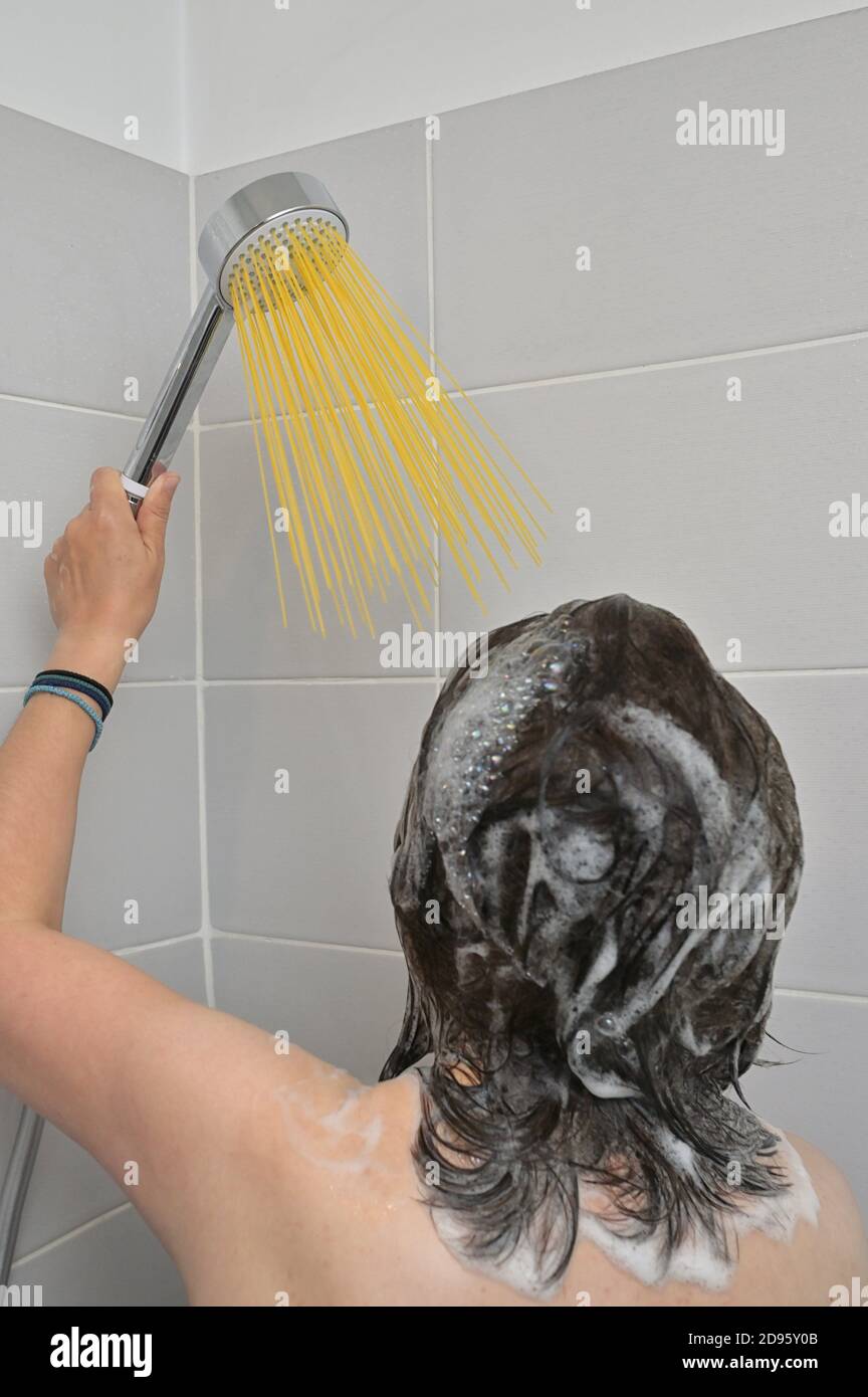 Abstract Girl Stands With Silver Shower and Long Pasta Spaghetti like ...