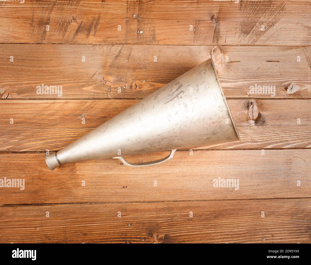 old metallic megaphone in a wood background Stock Photo - Alamy