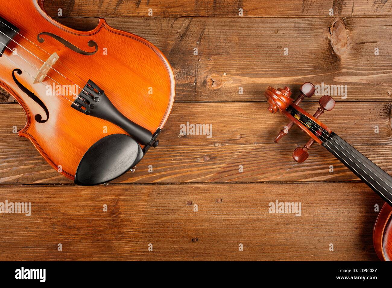 two violins in wood background Stock Photo - Alamy