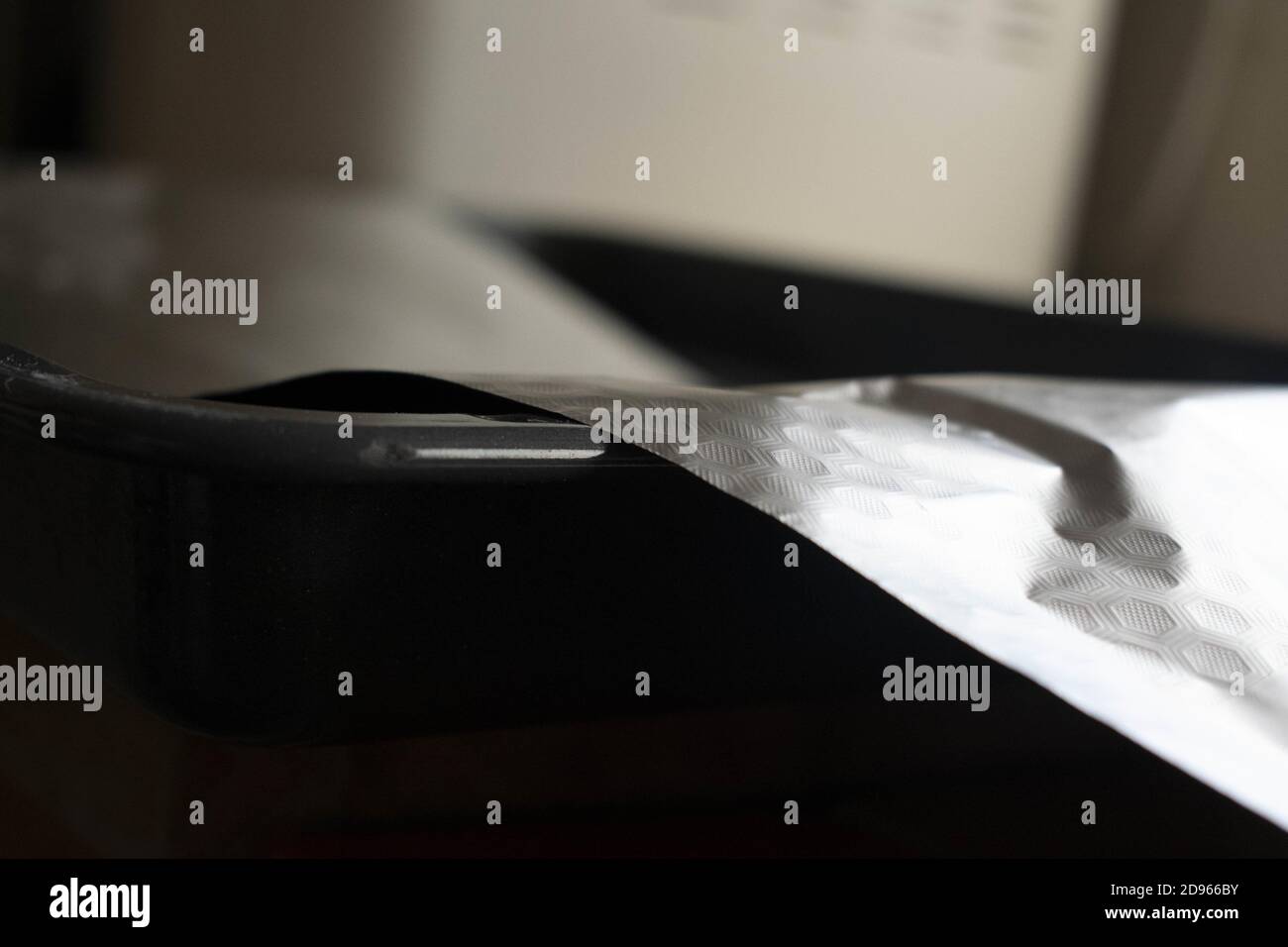 black backing sheet a aluminium foil Stock Photo - Alamy