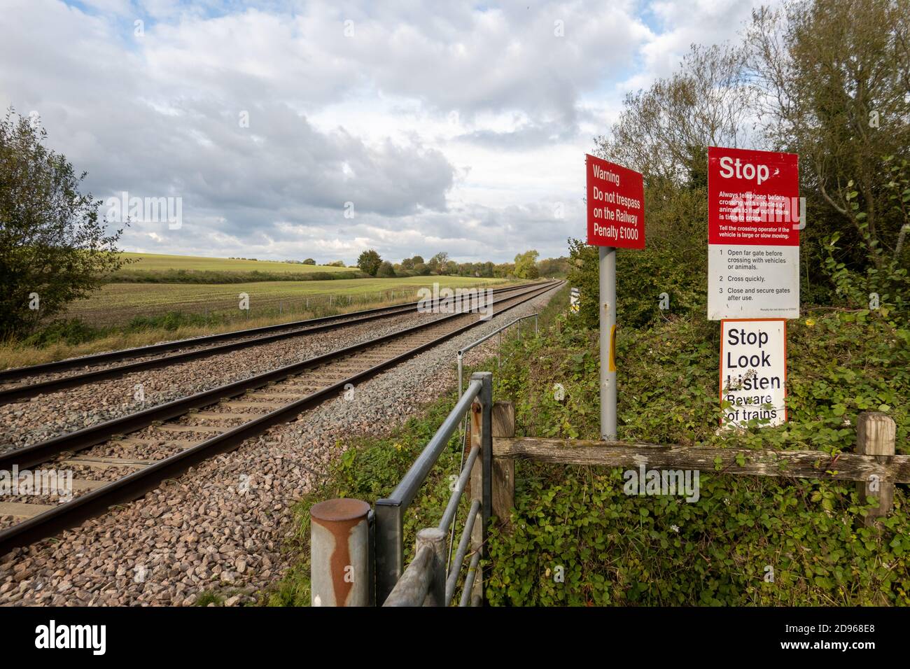 Rural railway level crossing signage Stock Photo - Alamy