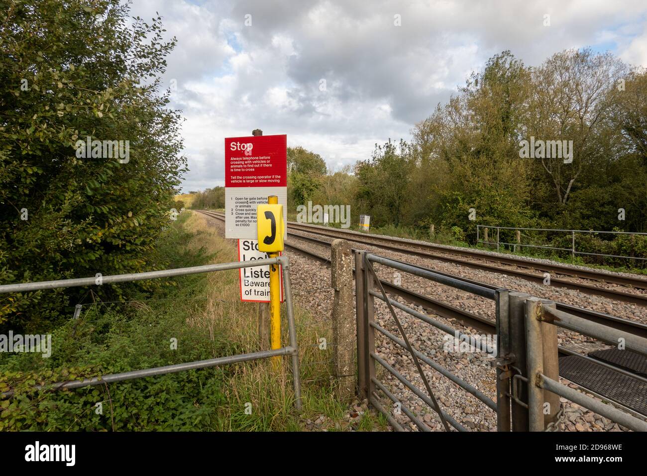 Rural railway level crossing signage Stock Photo - Alamy