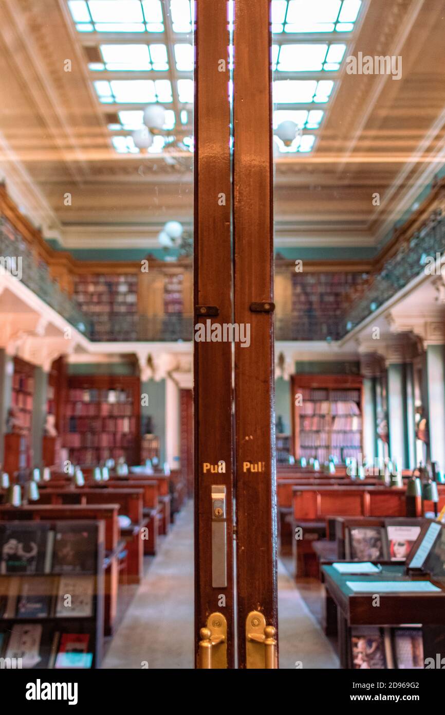Shot of a library from behind the closed glass doors Stock Photo - Alamy