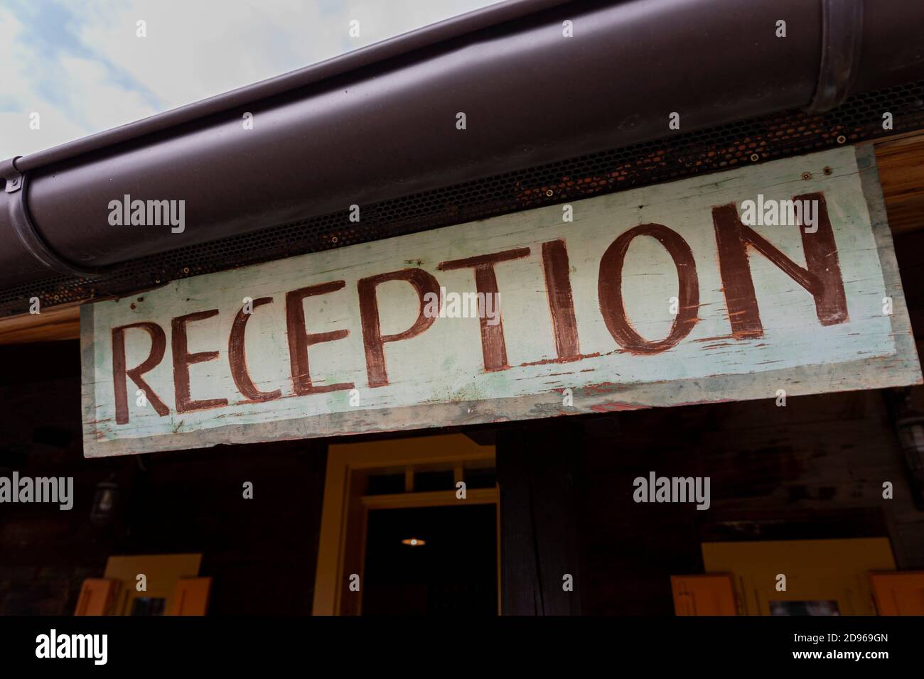 Reception sign made of wood at the Hotel entrance Stock Photo - Alamy