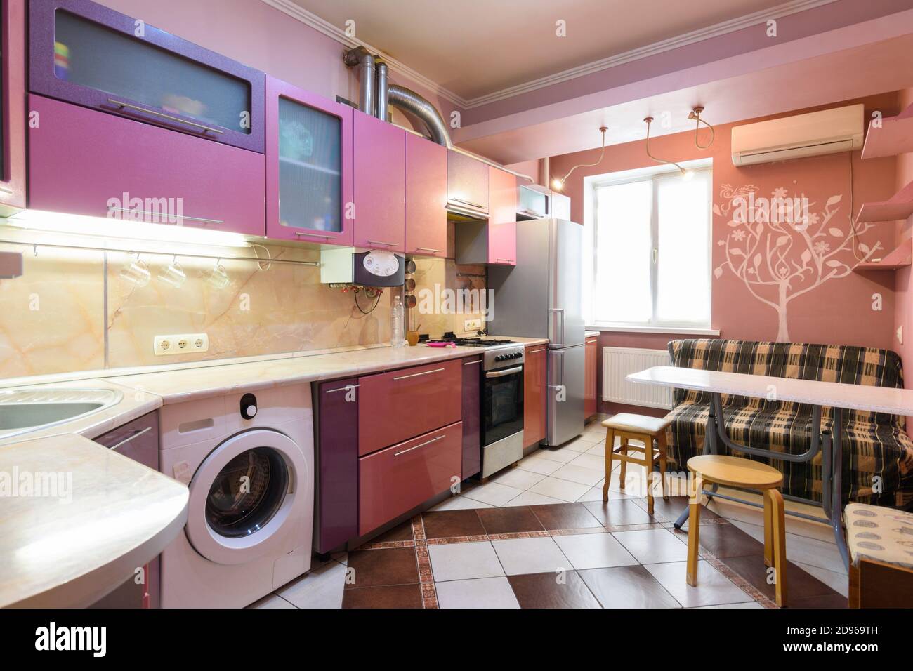 Interior of a modern kitchen in an apartment of a multi-storey building ...