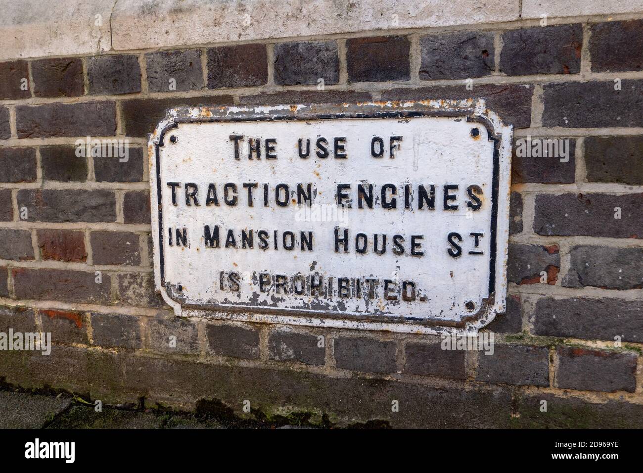 Sign on brick wall - "The Use of Traction Engines in Mansion House ...