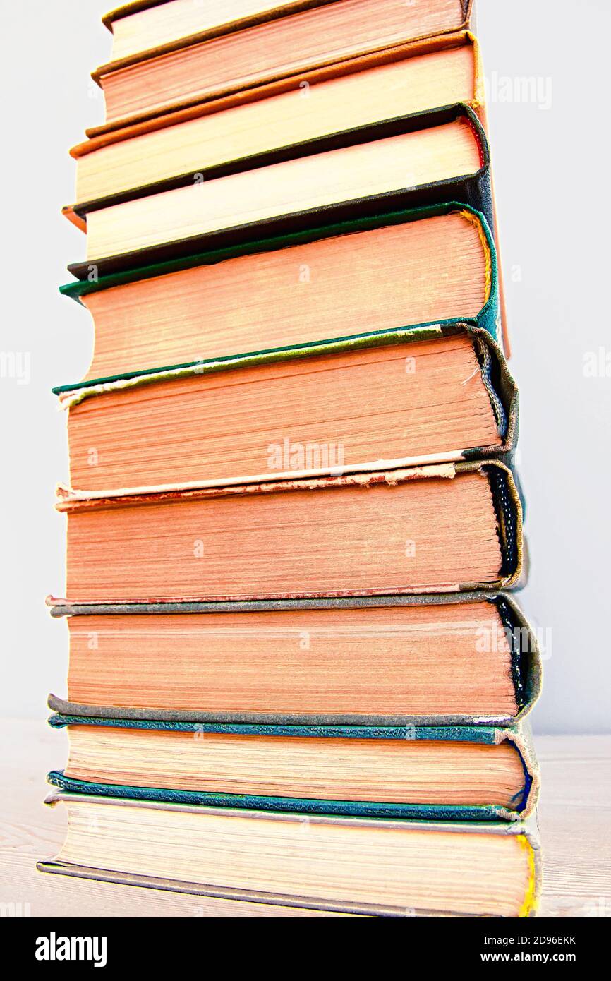 Tall stack of old book. Education concept background. Many books piles ...