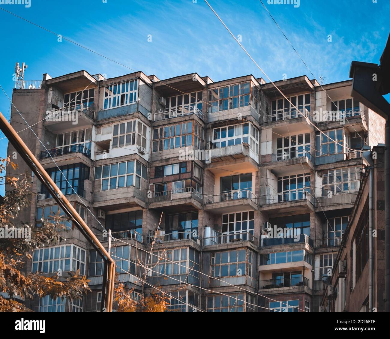 Old soviet residential building is seen through electrical wires Stock ...