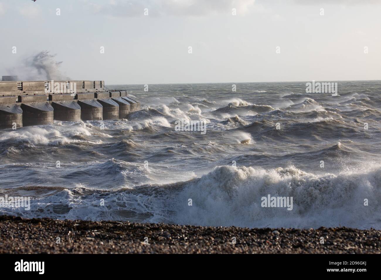 Rough seas breach the Marina wall on a windy Autumnal day in Brighton ...