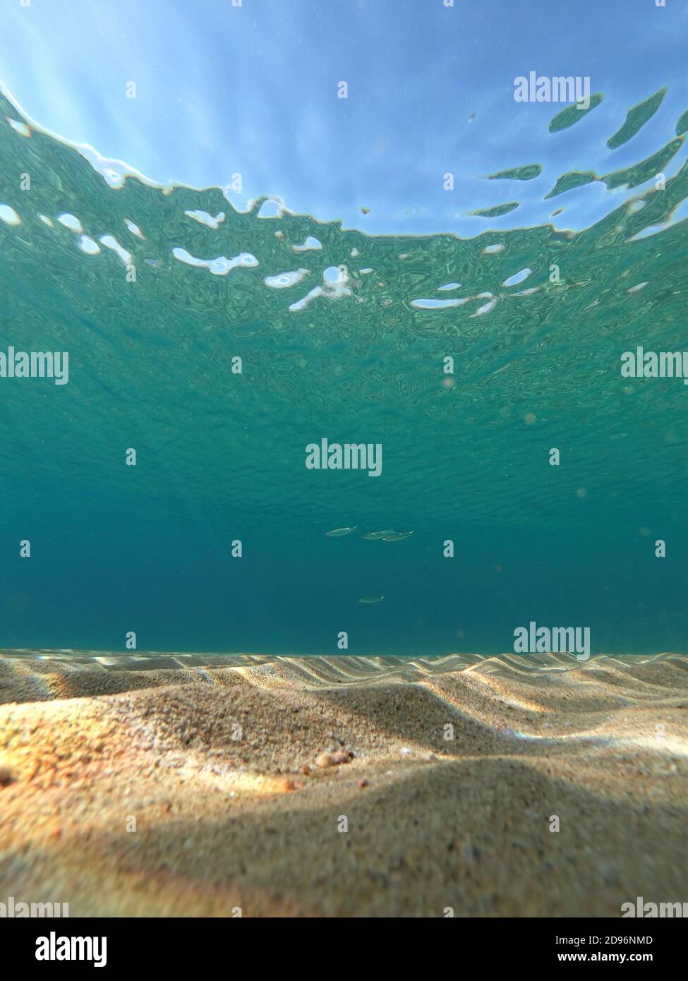 Transparent blue sea water in Spanish Costa Brava, vertical picture ...