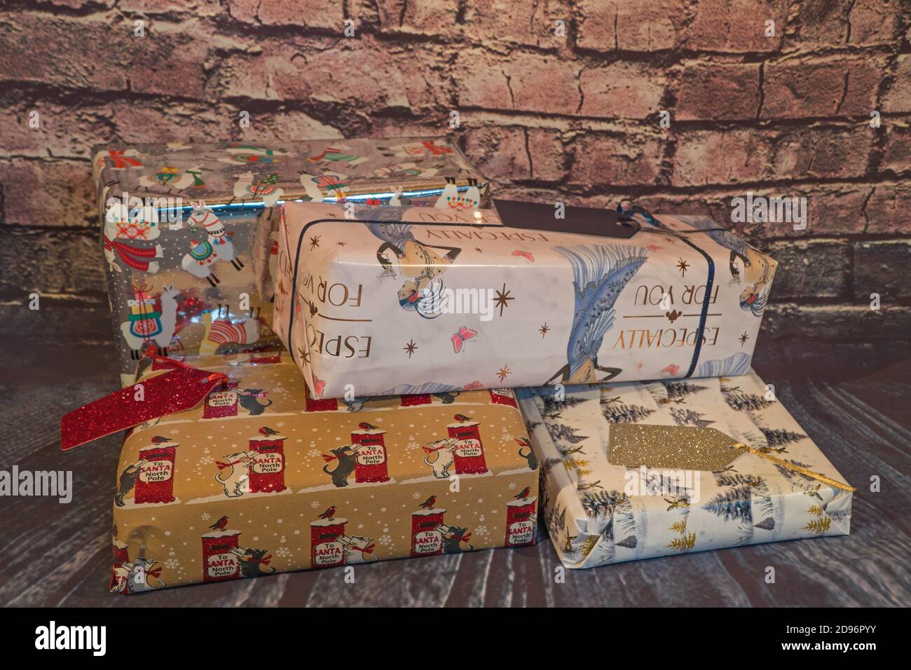 Christmas parcels stacked on floor Stock Photo - Alamy