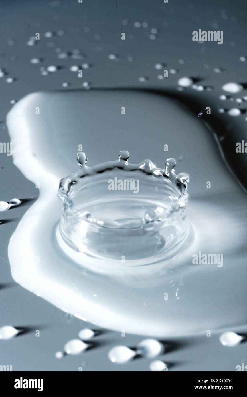High-speed shot of a water splash on a smooth surface Stock Photo - Alamy