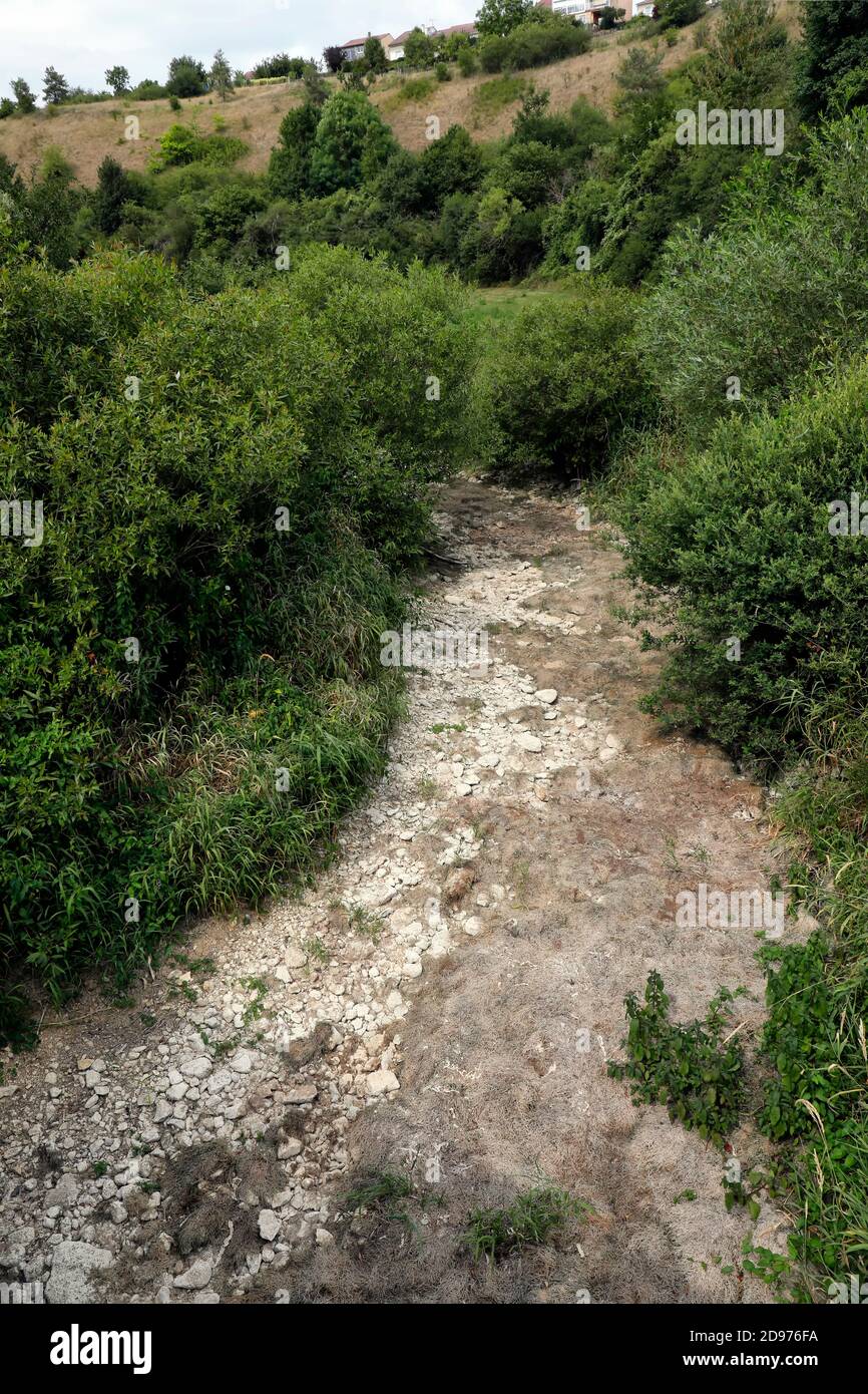 Dry stream at the end of a very dry summer, along a dry lawn, Terroin ...