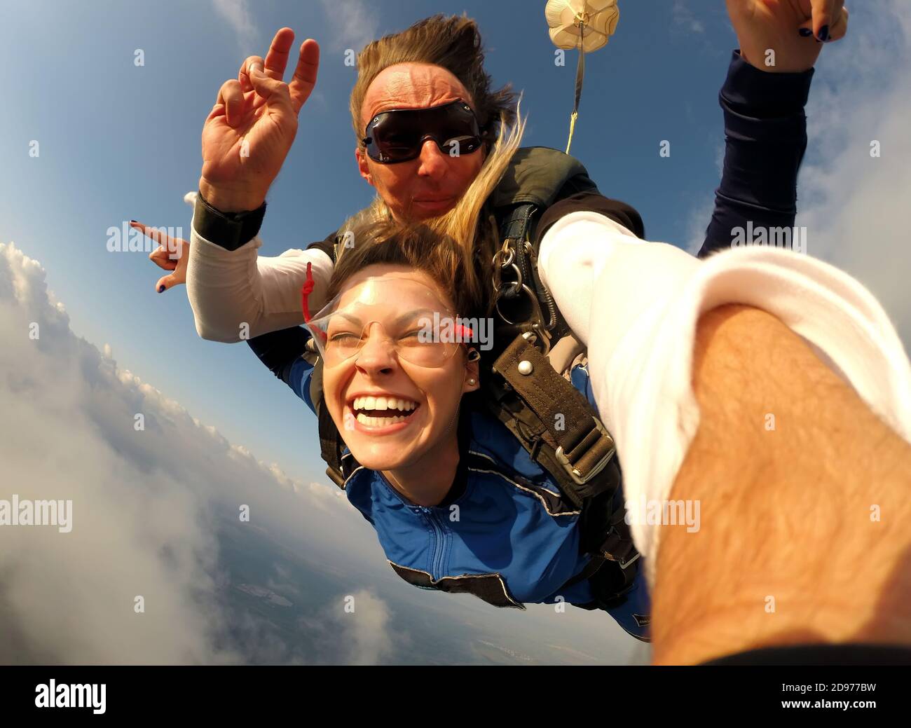 Selfie tandem skydiving with pretty woman Stock Photo - Alamy