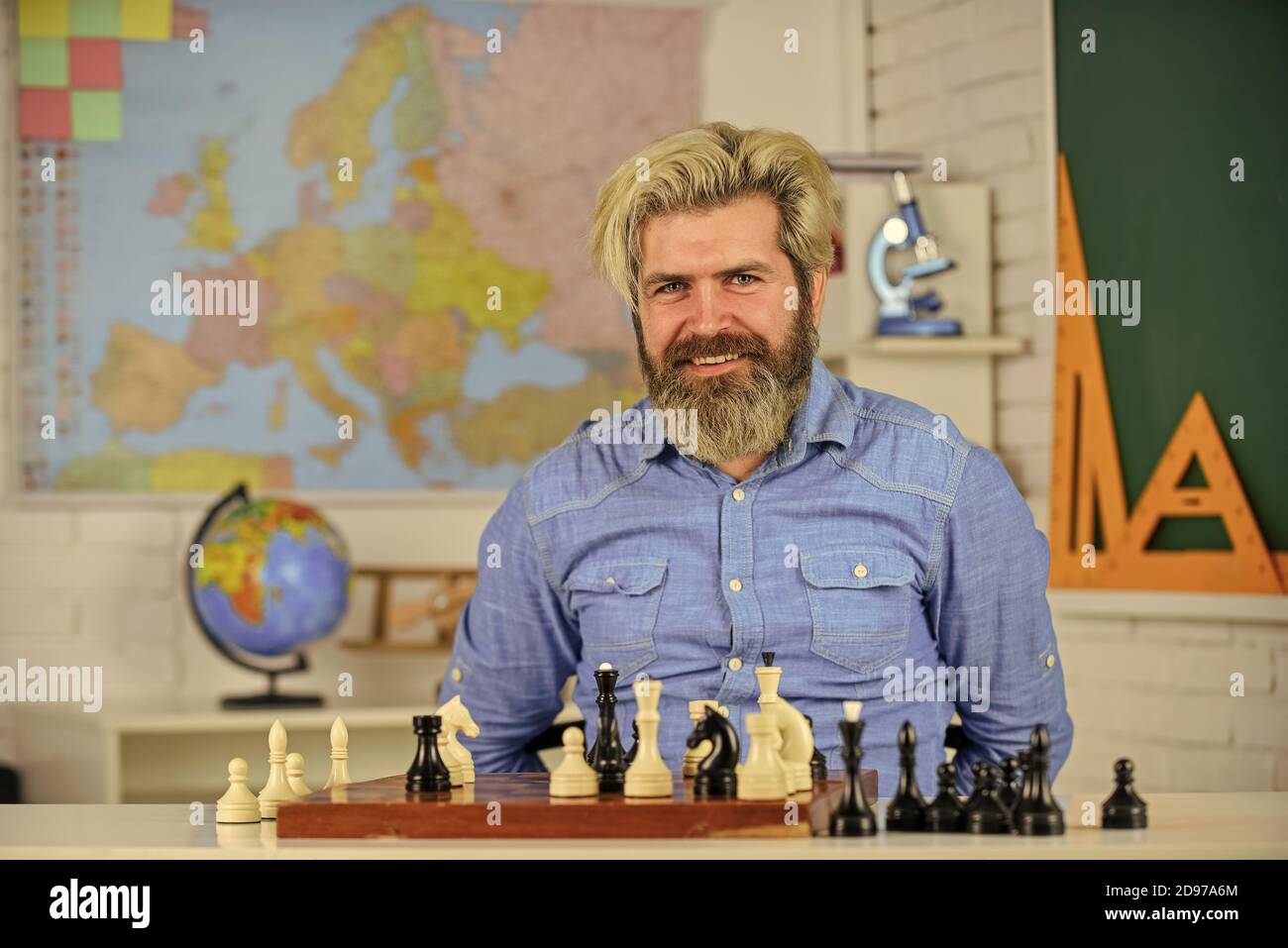 playing chess develops brain functioning. man hold chess piece ...