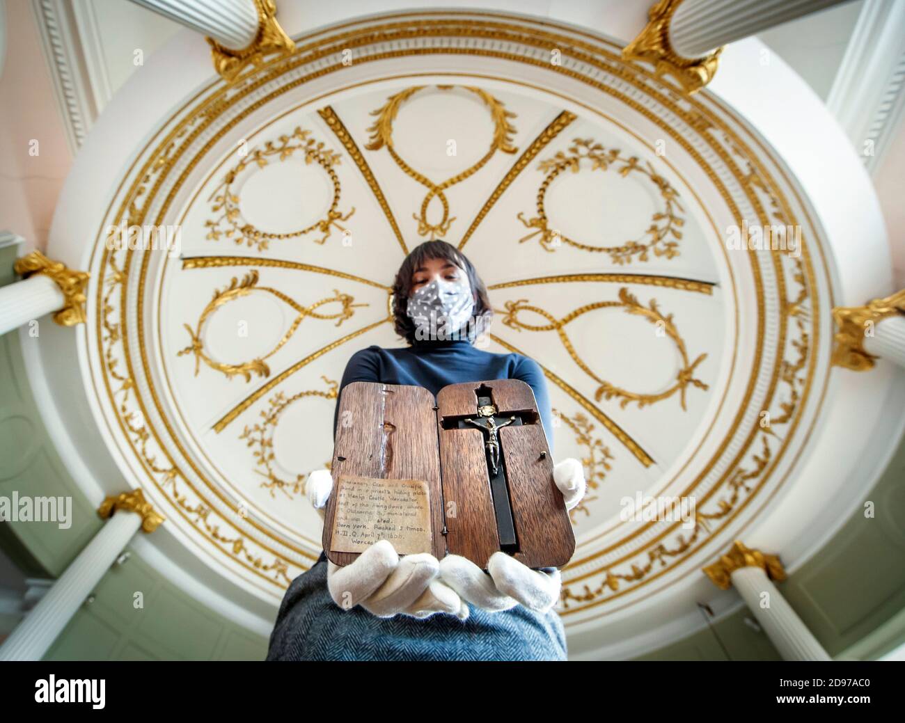 Special collections manager Dr. Hannah Thomas holds Blessed Edward ...