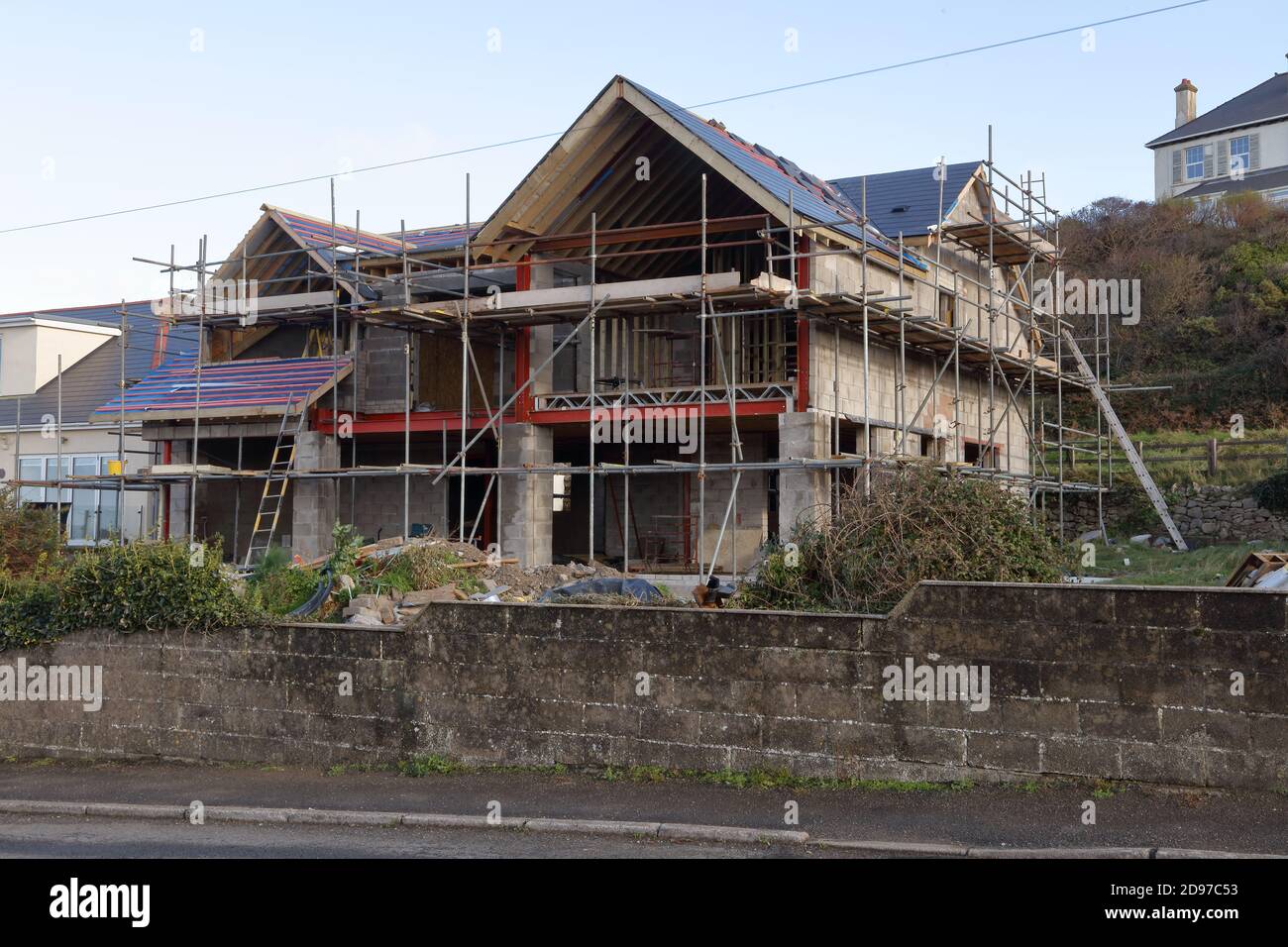 A new build well under way with tiles now going on the roof and ...