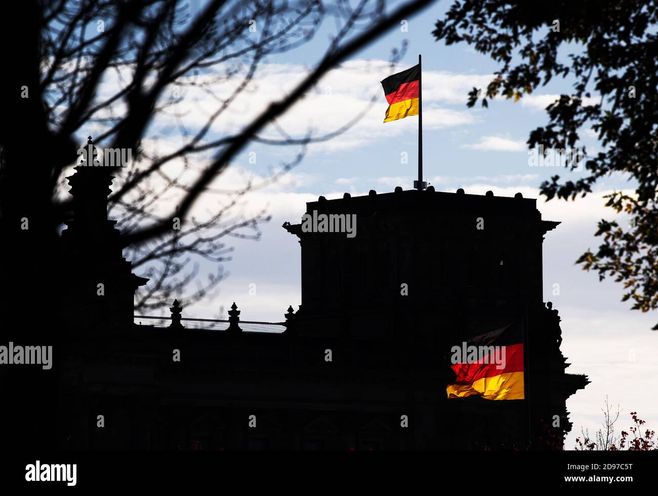 Berlin, Germany. 03rd Nov, 2020. Brightly the German flags shine in the ...