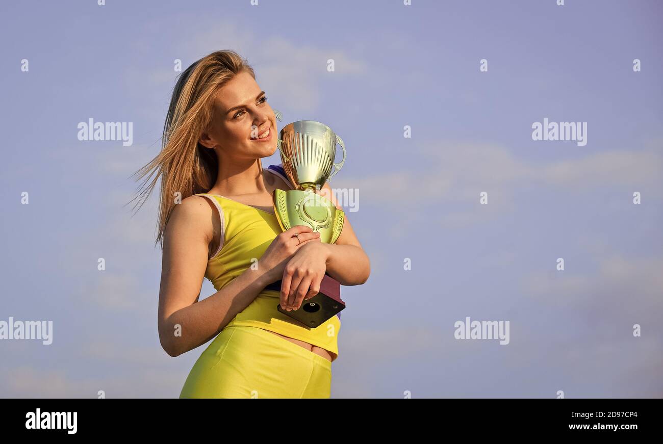 Gold prize. Cute athlete being awarded with cup. First place award and ...