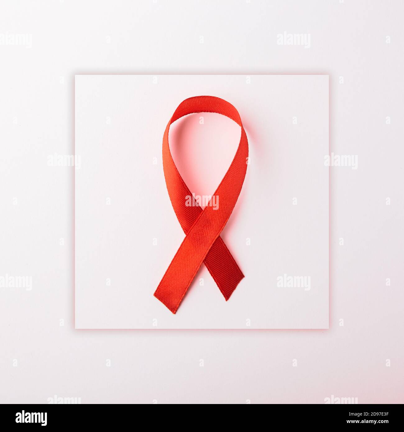 Red bow ribbon symbol HIV, AIDS cancer awareness with shadows, studio ...