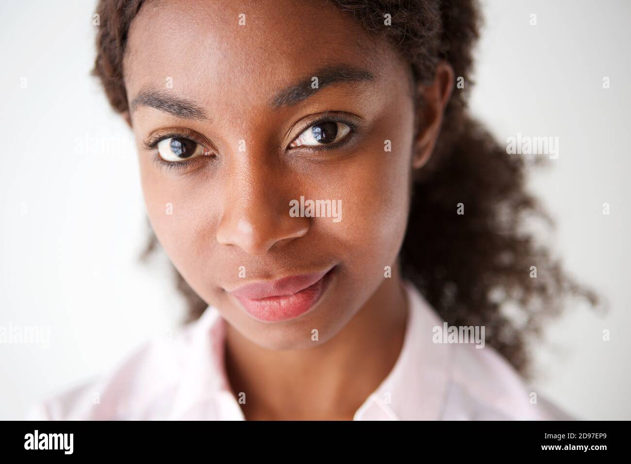 Close up portrait of young african woman face on white background Stock ...