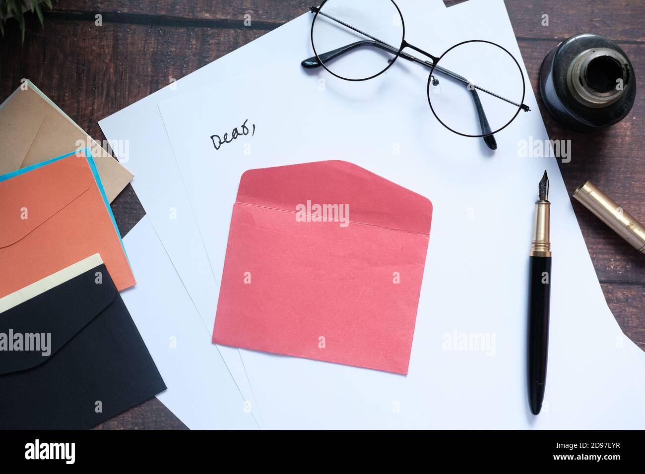 envelope , empty paper and fountain pen on table Stock Photo - Alamy
