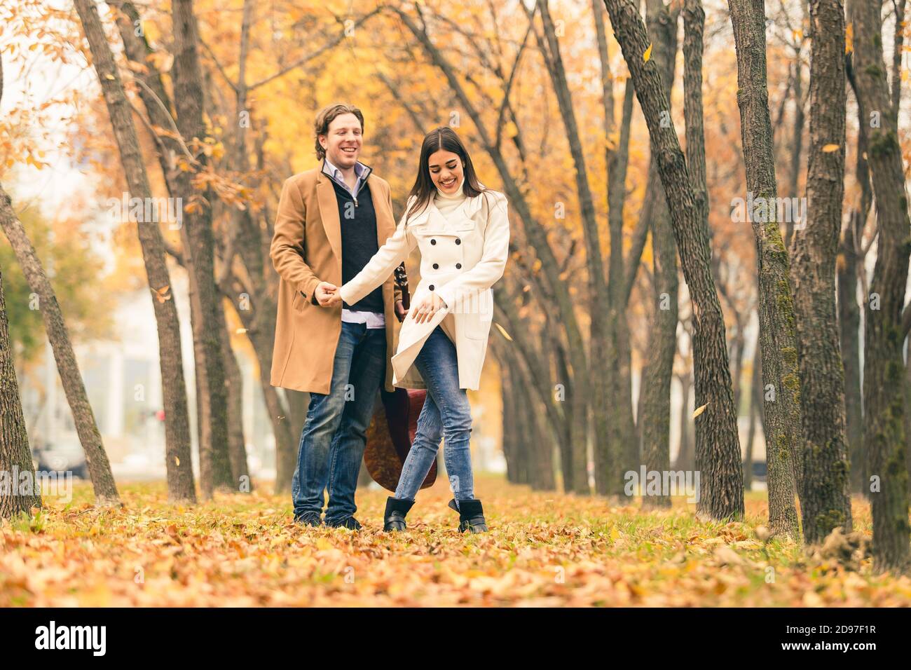 Couple having fun leaves hi-res stock photography and images - Alamy