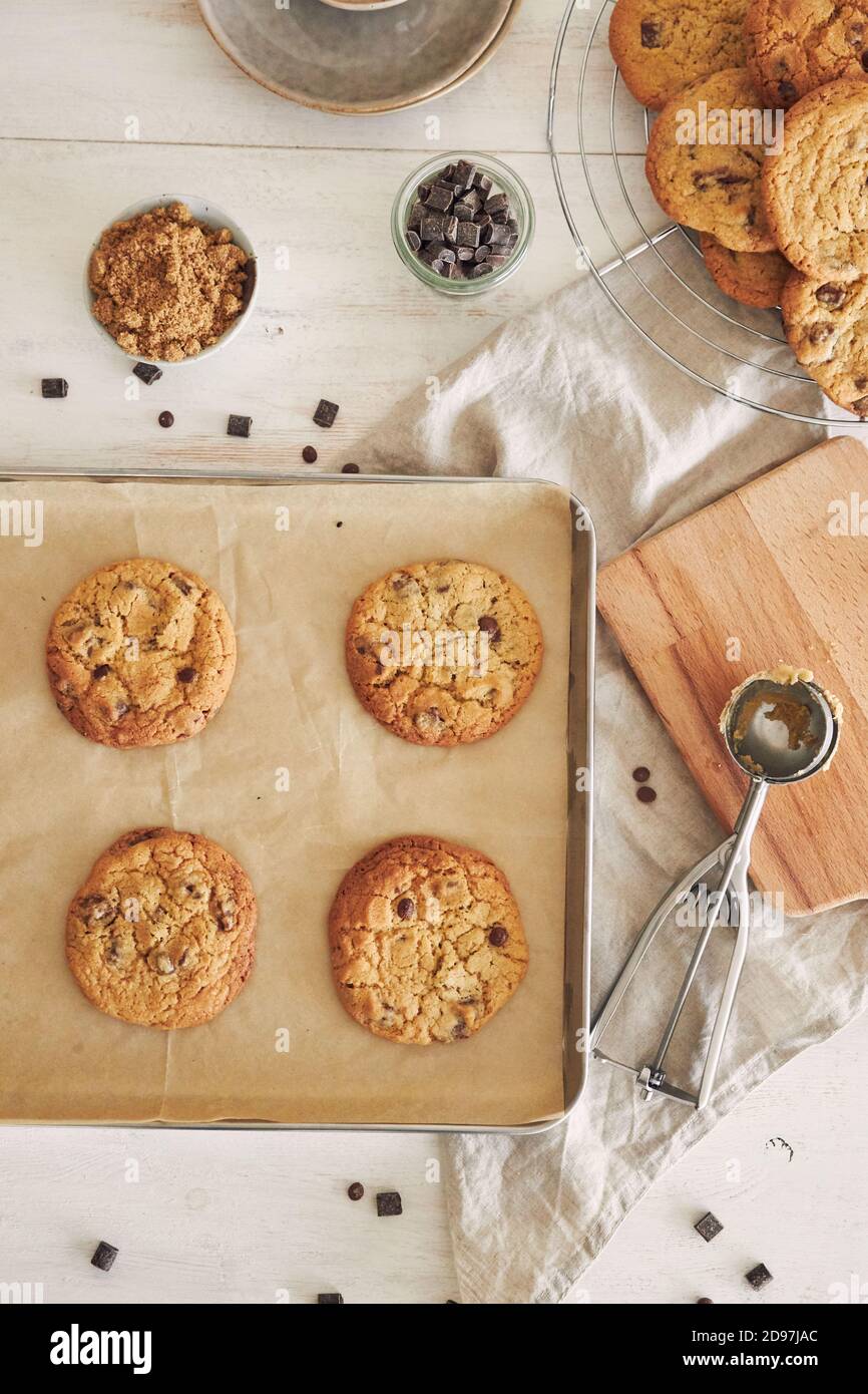 Vertical top view of delicious chocolate chips cookies on an oven tray ...