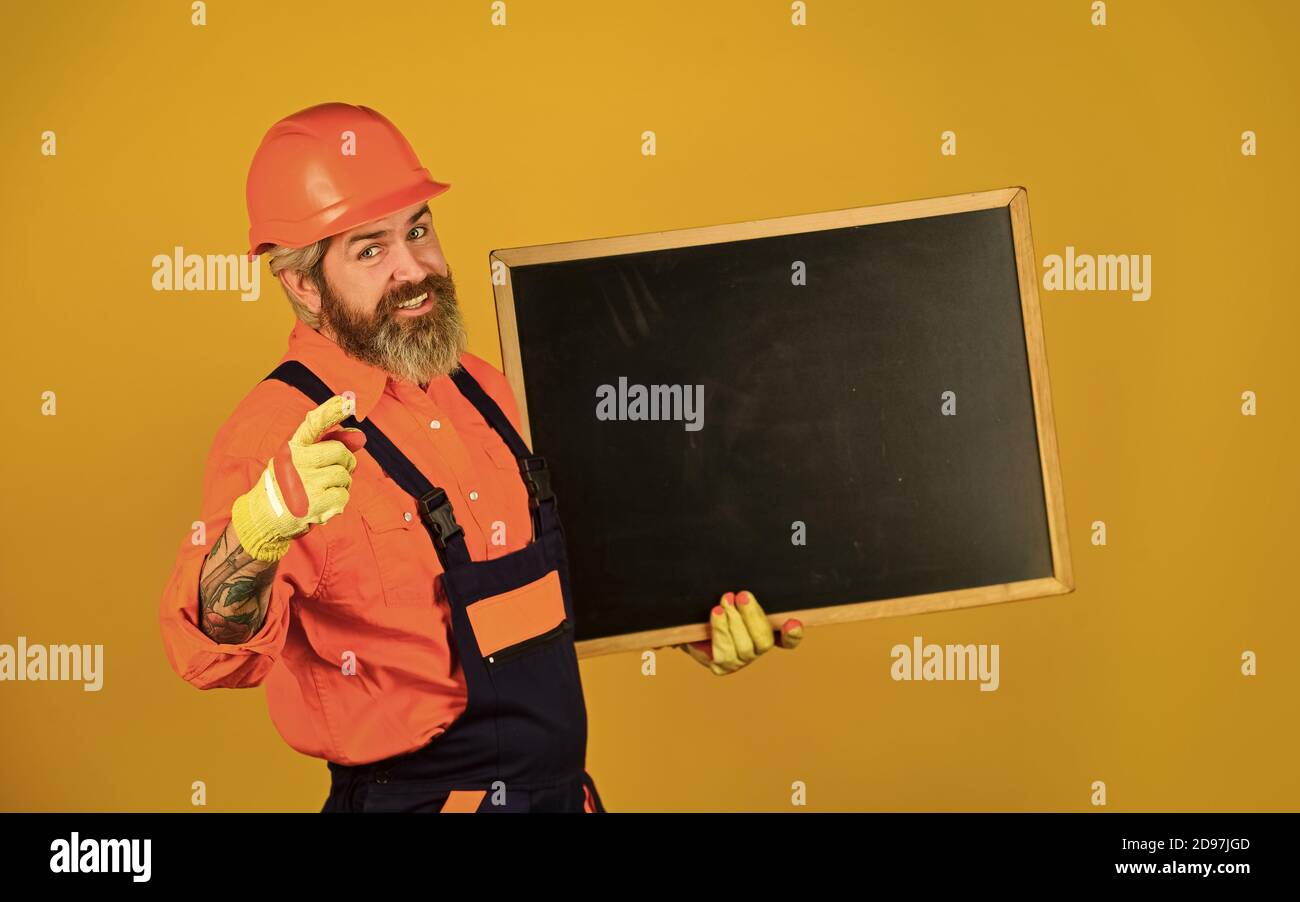 Presentation on blackboard plan for construction. Builder man serious ...