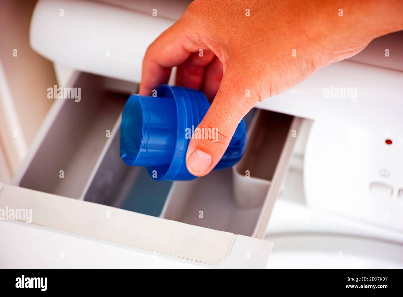Woman laundry detergent washing machine hi-res stock photography and ...