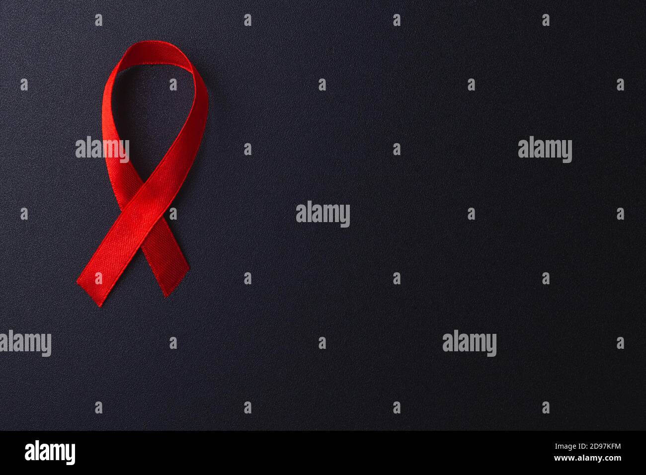 Red bow ribbon symbol HIV, AIDS cancer awareness with shadows, studio ...