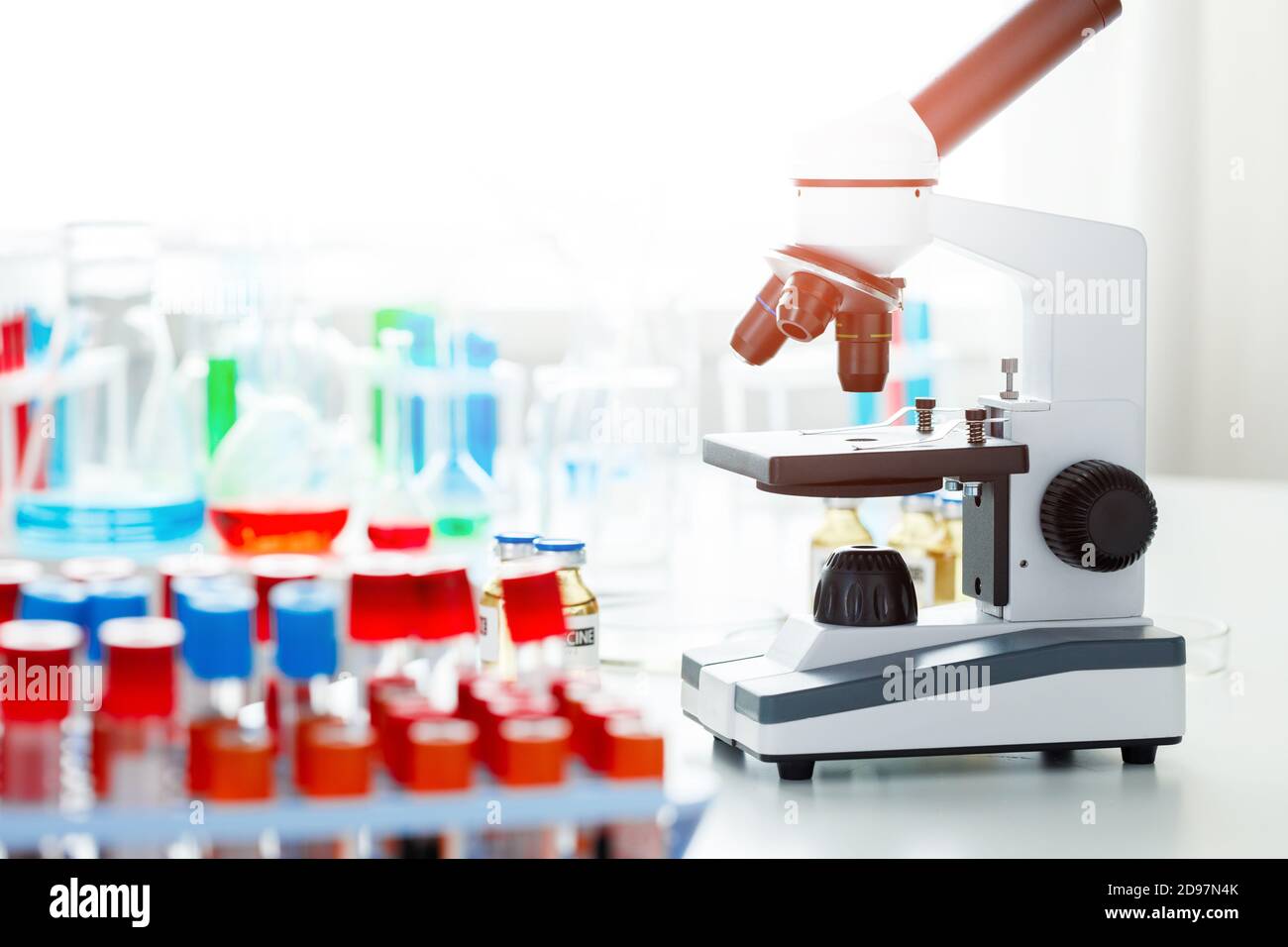 Microscope on the table with glassware in laboratory Stock Photo - Alamy