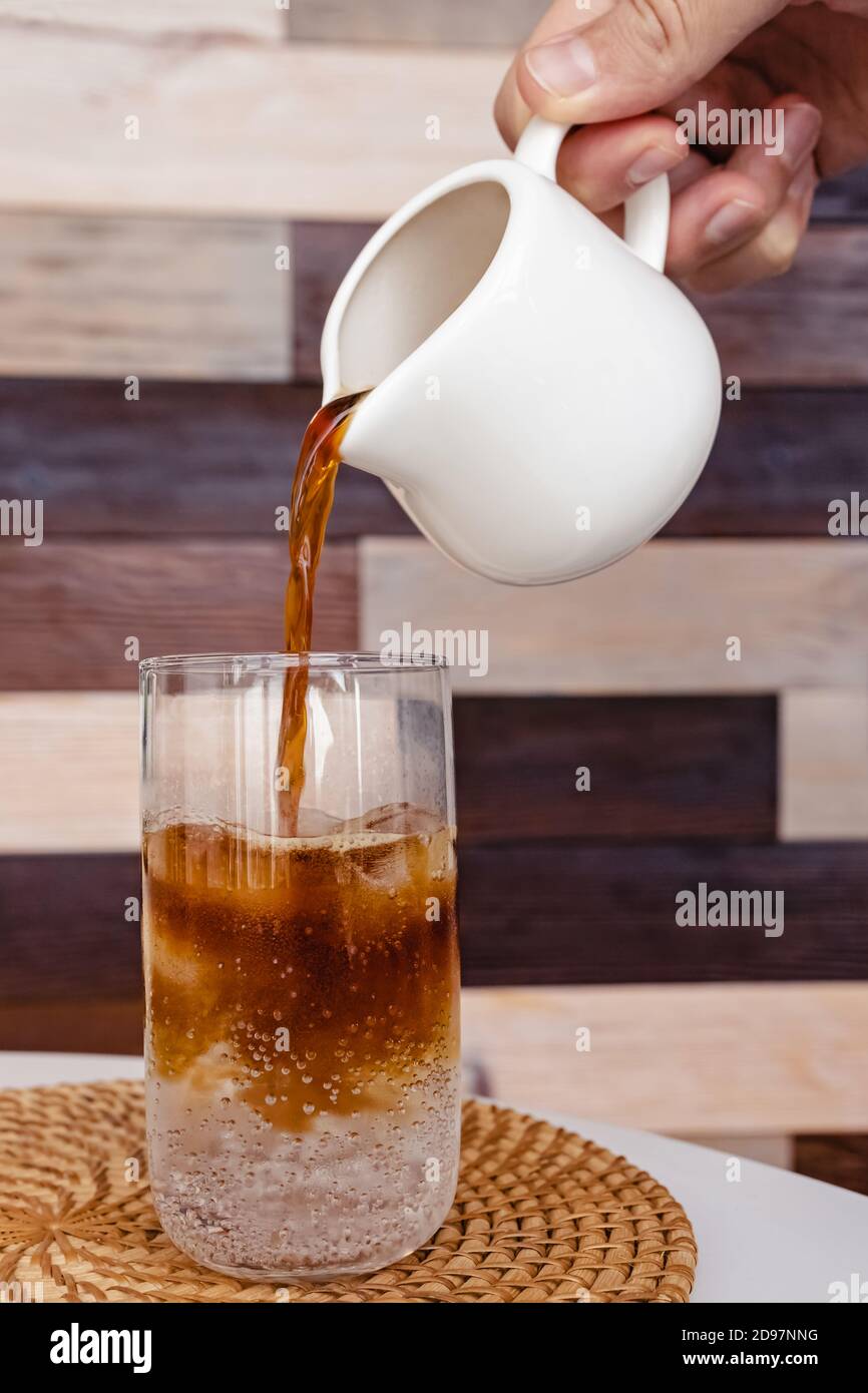 Mans hand pouring hi-res stock photography and images - Alamy