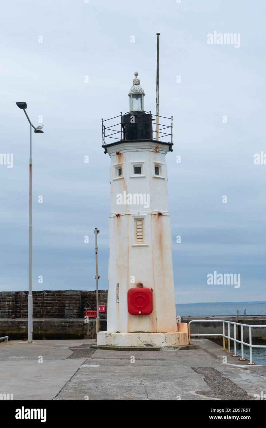 Anstruther lighthouse in Scotland. Vertical photograph. Cloudy day ...