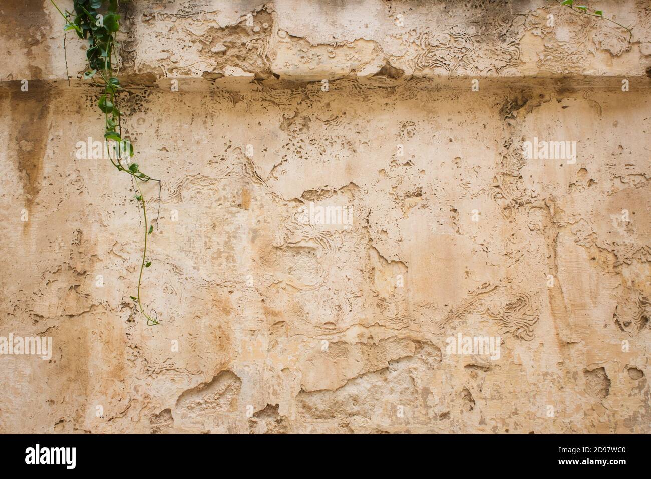 Old weathered stone and plaster wall background Stock Photo - Alamy
