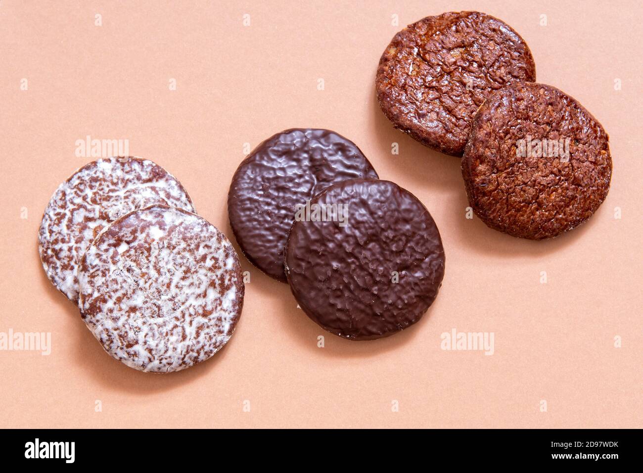 Three types of German round gingerbreads neutral light brown background ...