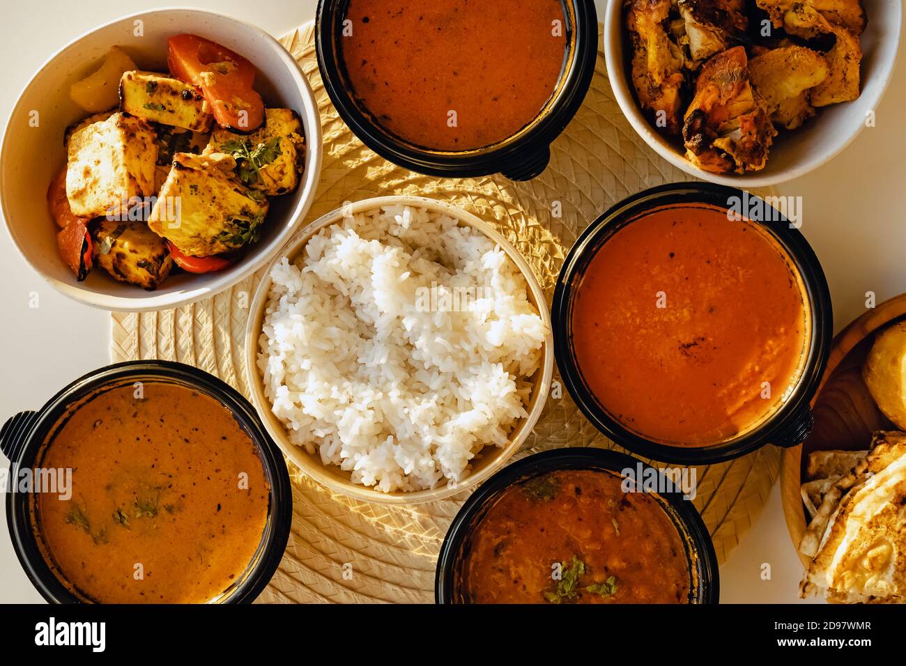 Selection of curries and rice. Indian food in small bowls Stock Photo ...