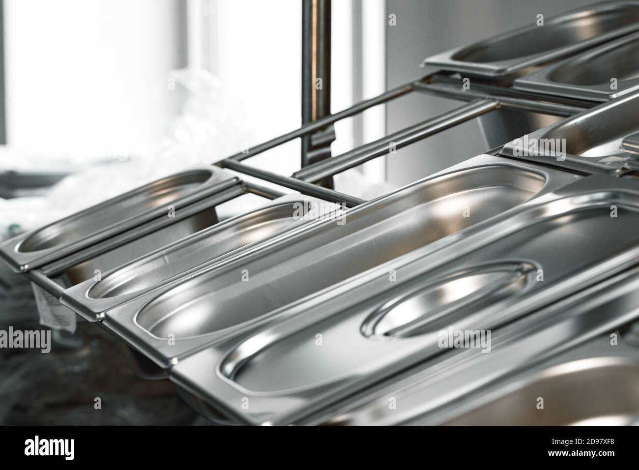 Industrial kitchen metal trays for buffet catering Stock Photo - Alamy