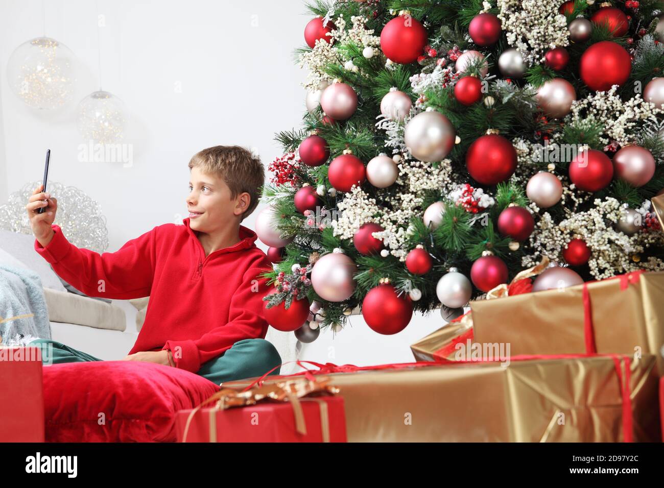 merry christmas and happy holidays, child stay at home with mobile ...
