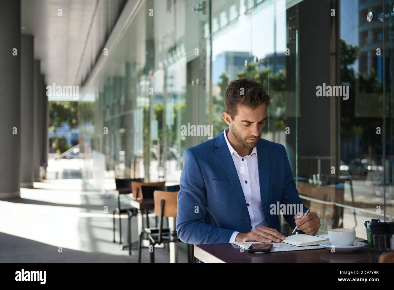 Sitting smart man drinking alone hi-res stock photography and images ...